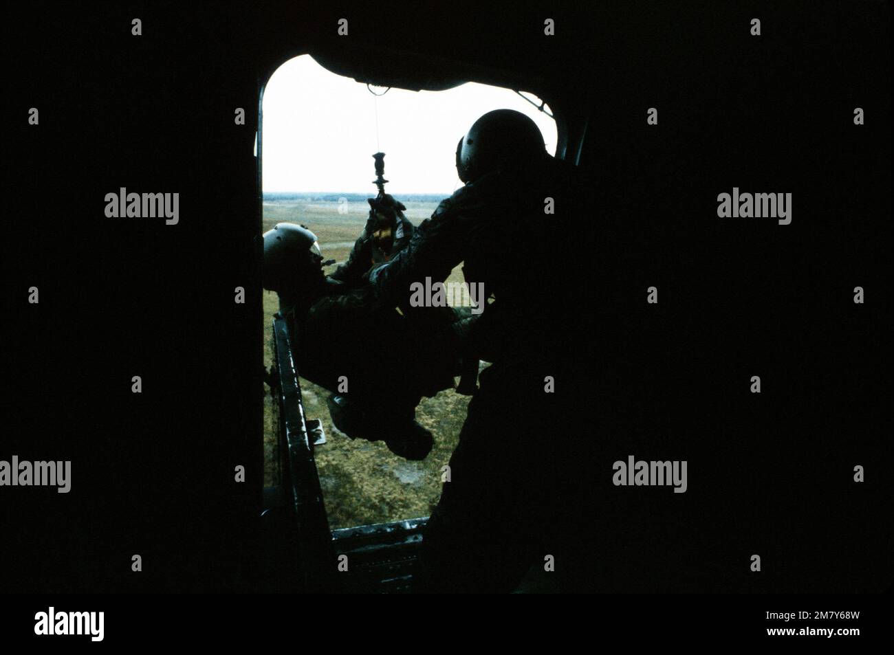CPT Frank Gray, a "victim" of a downed aircraft, is hoisted into a HH ...