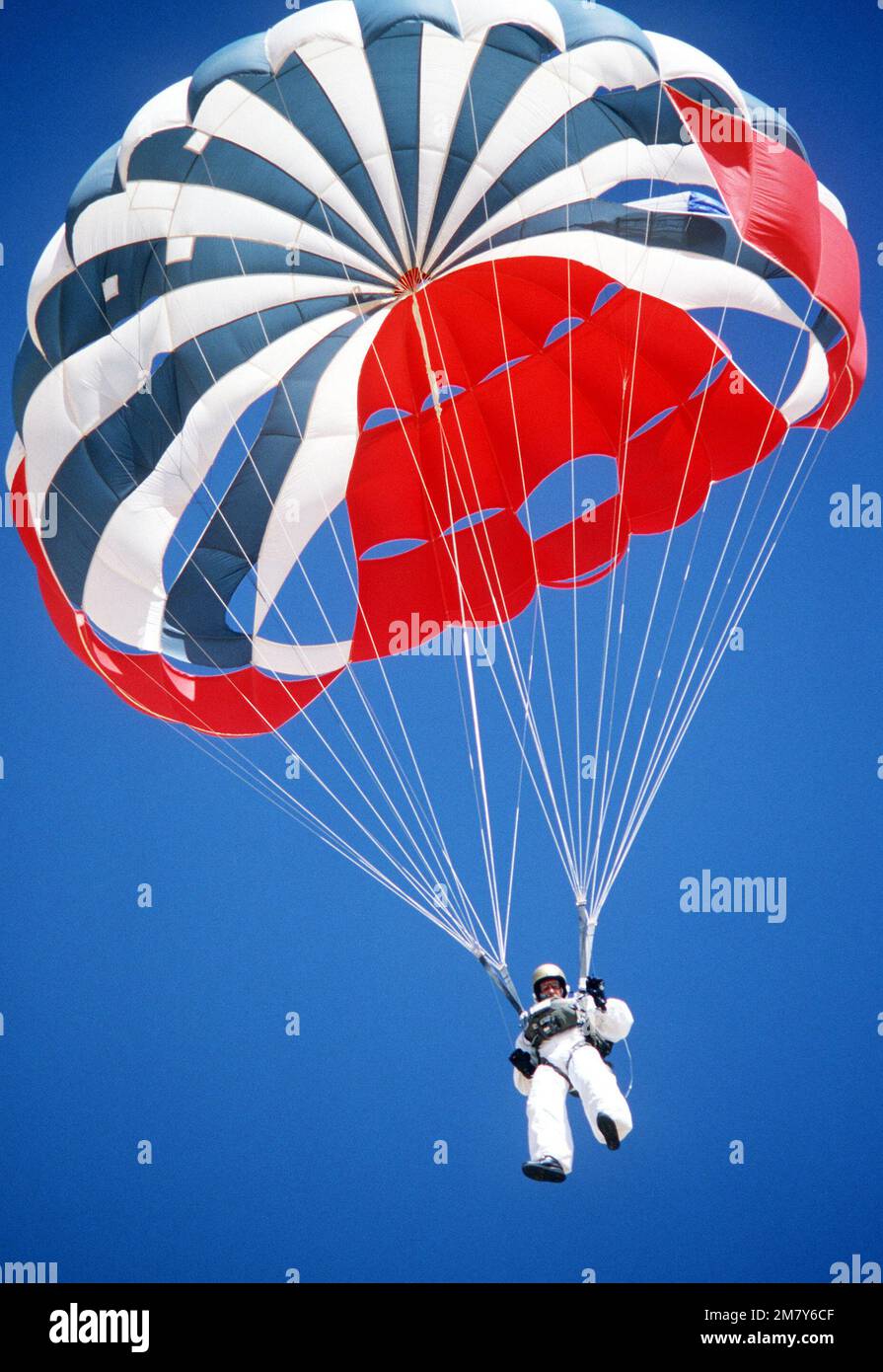 A member of the parachute-test team descends toward his target at the ...