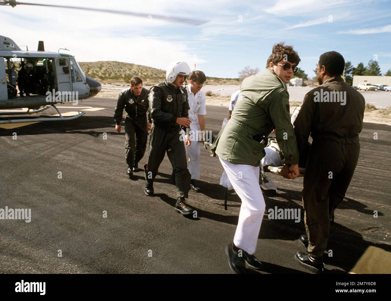TSGT Tony Biondo is carried by stretcher to a waiting helicopter, after ...