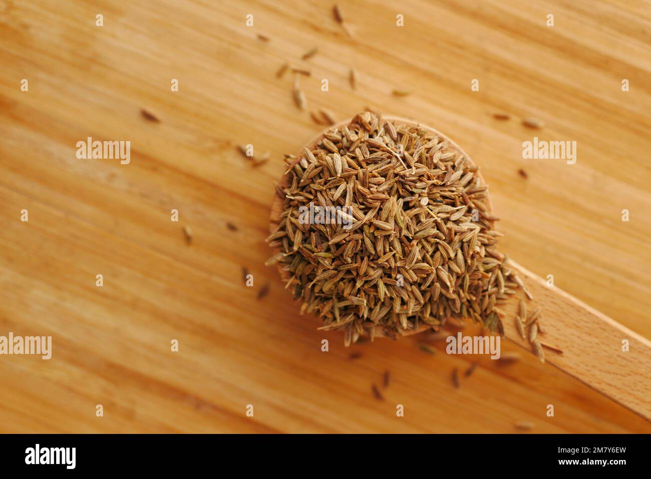 cumin seeds on spoon on table , close up Stock Photo - Alamy