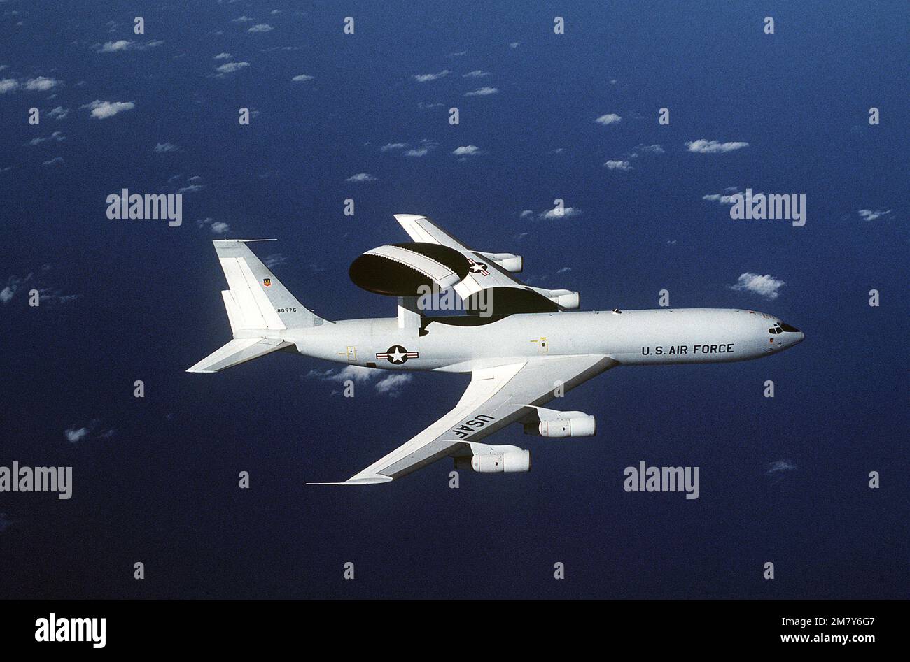 An air-to-air right side view of an E-3A Sentry Airborne Warning and ...