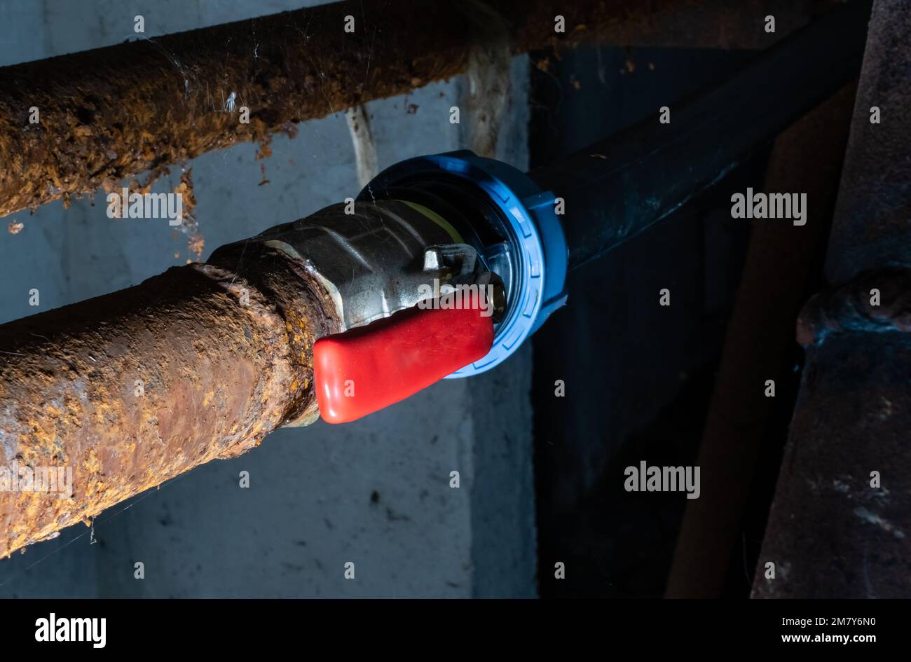 Faucet of water plastic pipe in open position on blurred background of ...