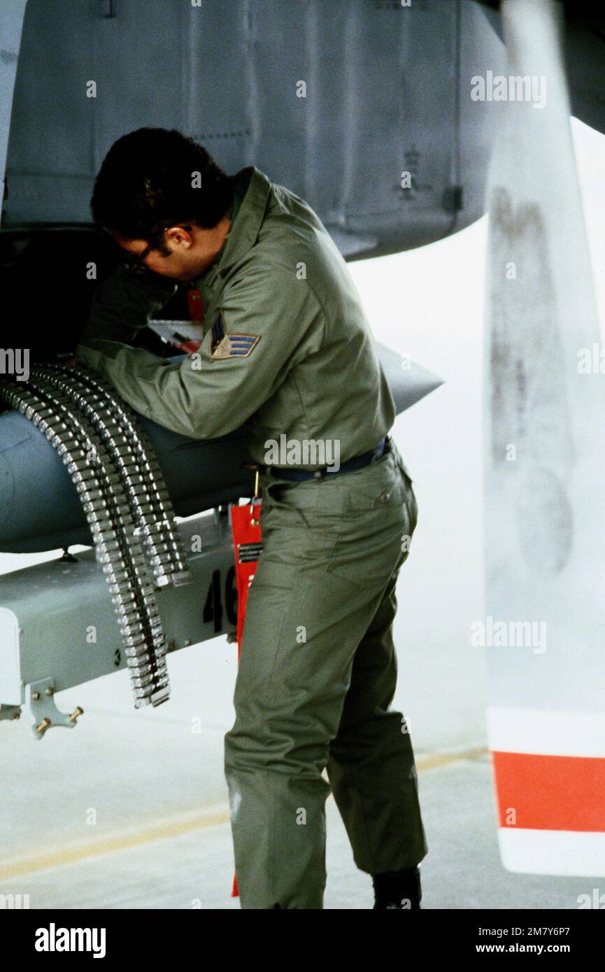 A1C Aaron Franklin loads 7.62mm shells into the weapon system of an OV ...