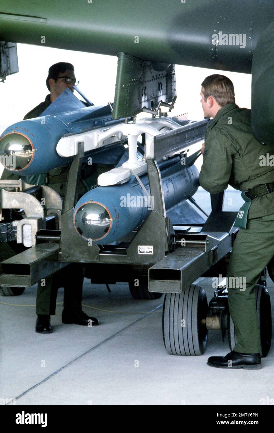 Members of a loading crew from the 6151st Consolidated Aircraft ...