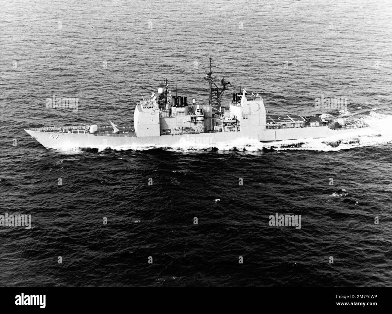 An aerial port beam view of the Aegis guided missile cruiser USS ...