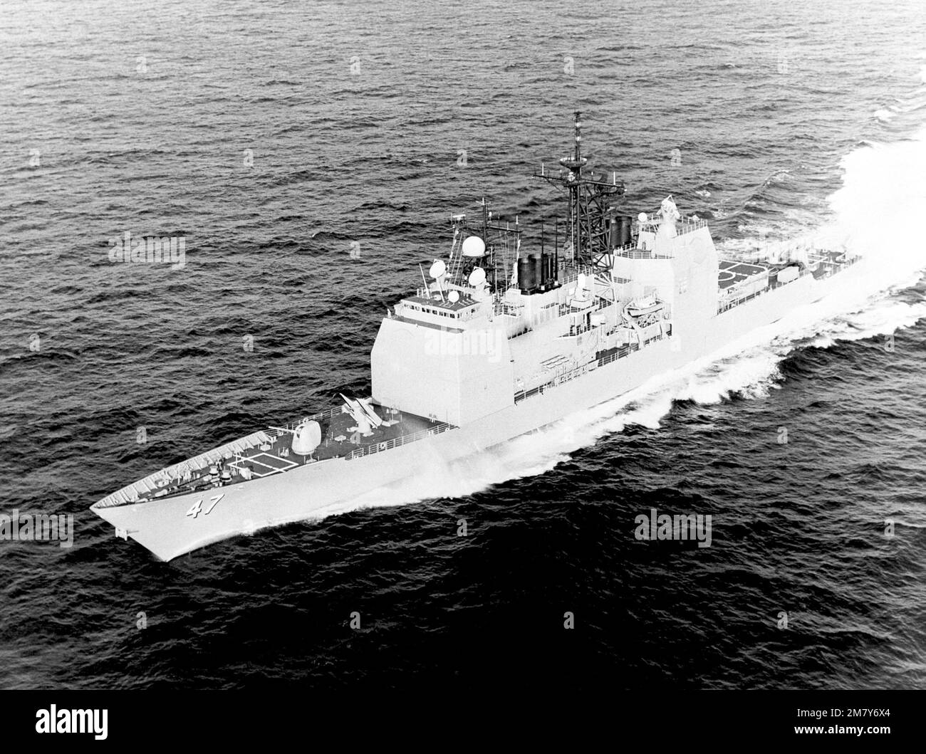 An aerial port quarter view of the Aegis guided missile cruiser USS ...
