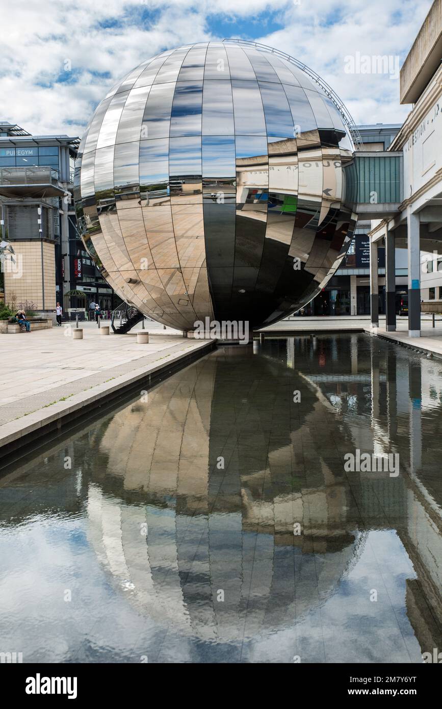 The large sphere of the 3D planetarium with its reflection in the pond ...