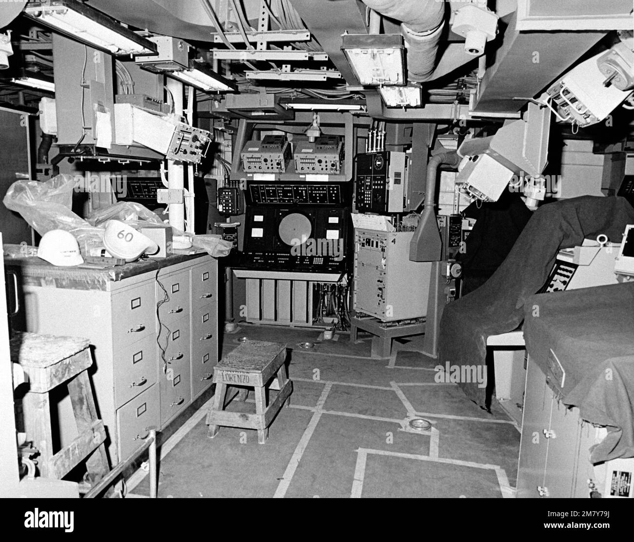 An interior view of the combat information center on the guided missile ...