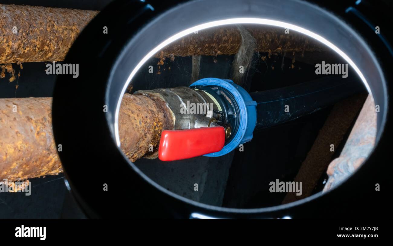 Faucet of water plastic pipe in open position on blurred background of ...