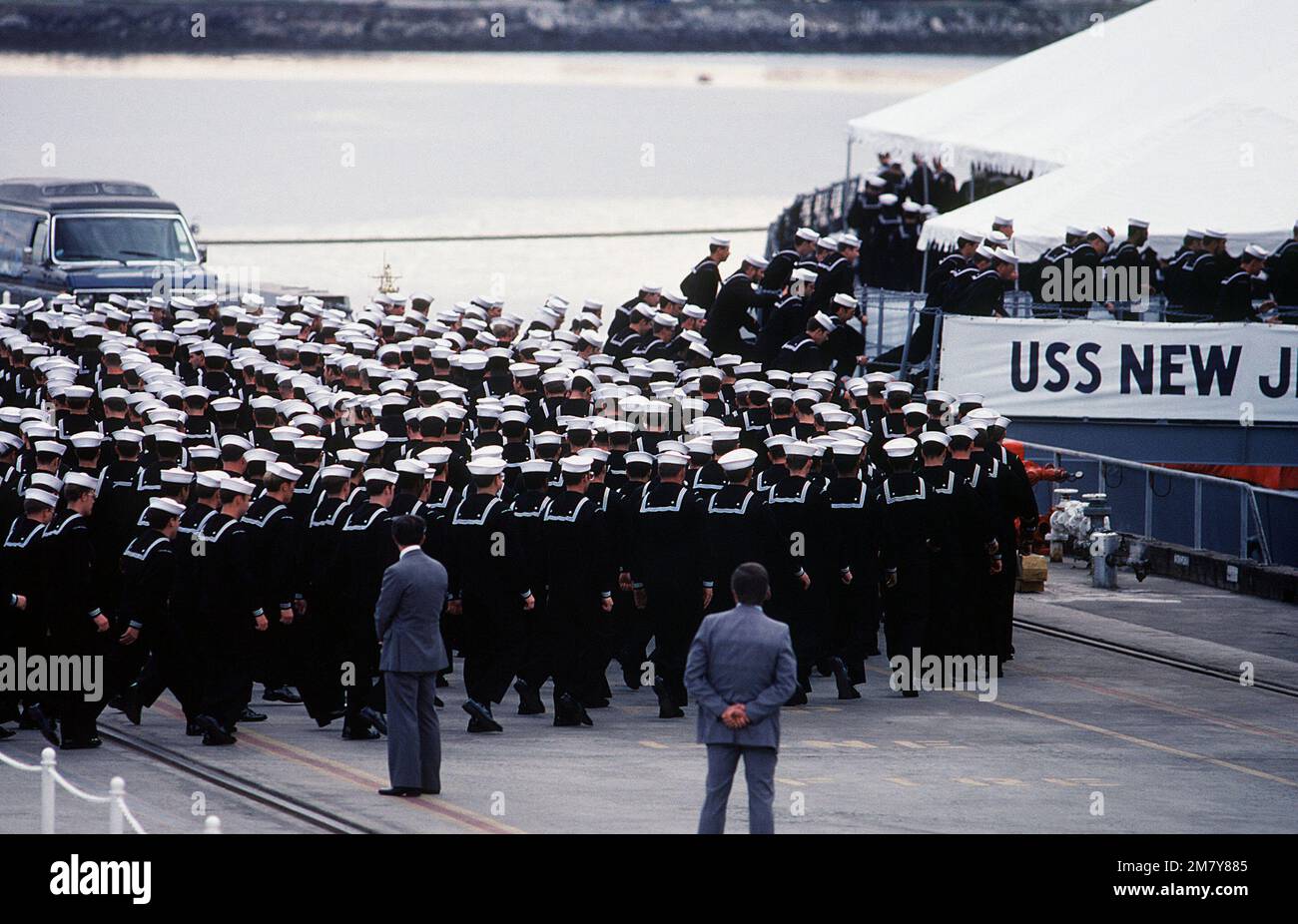 Crewmen go aboard the battleship USS NEW JERSEY (BB-62) during its ...