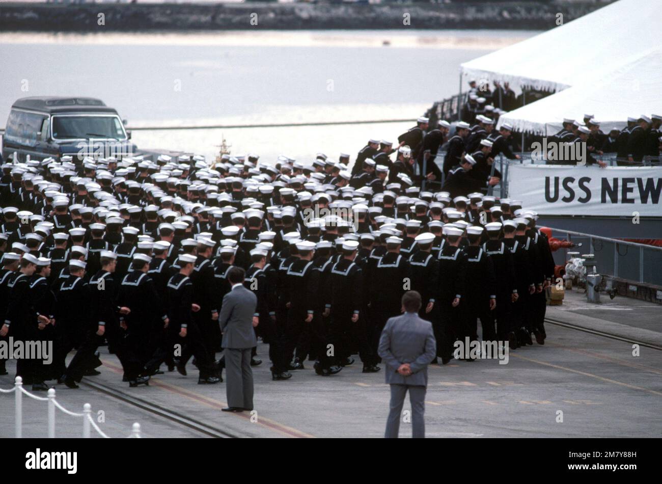 Crewmen aboard the battleship USS NEW JERSEY (BB-62) during the ...