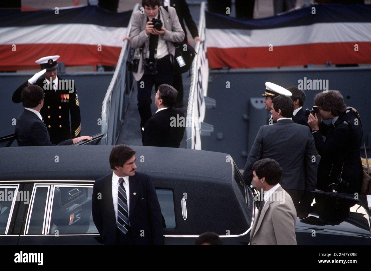 President Ronald Reagan's limousine arrives on the pier prior to the ...