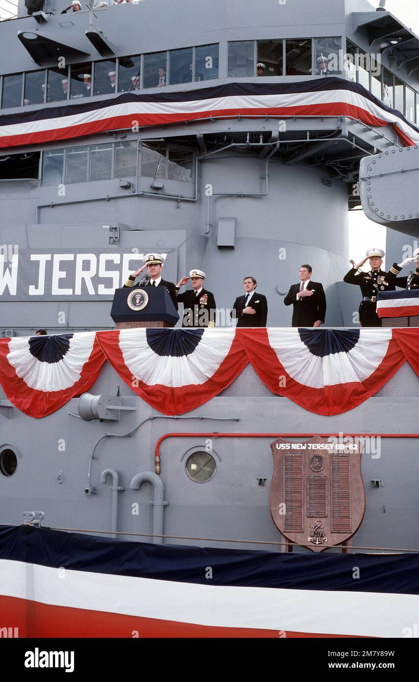 Guests stand on the speakers platform as the national anthem is played ...