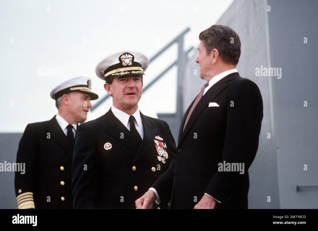 President Ronald Reagan, right, speaks to CAPT William M. Fogarty ...