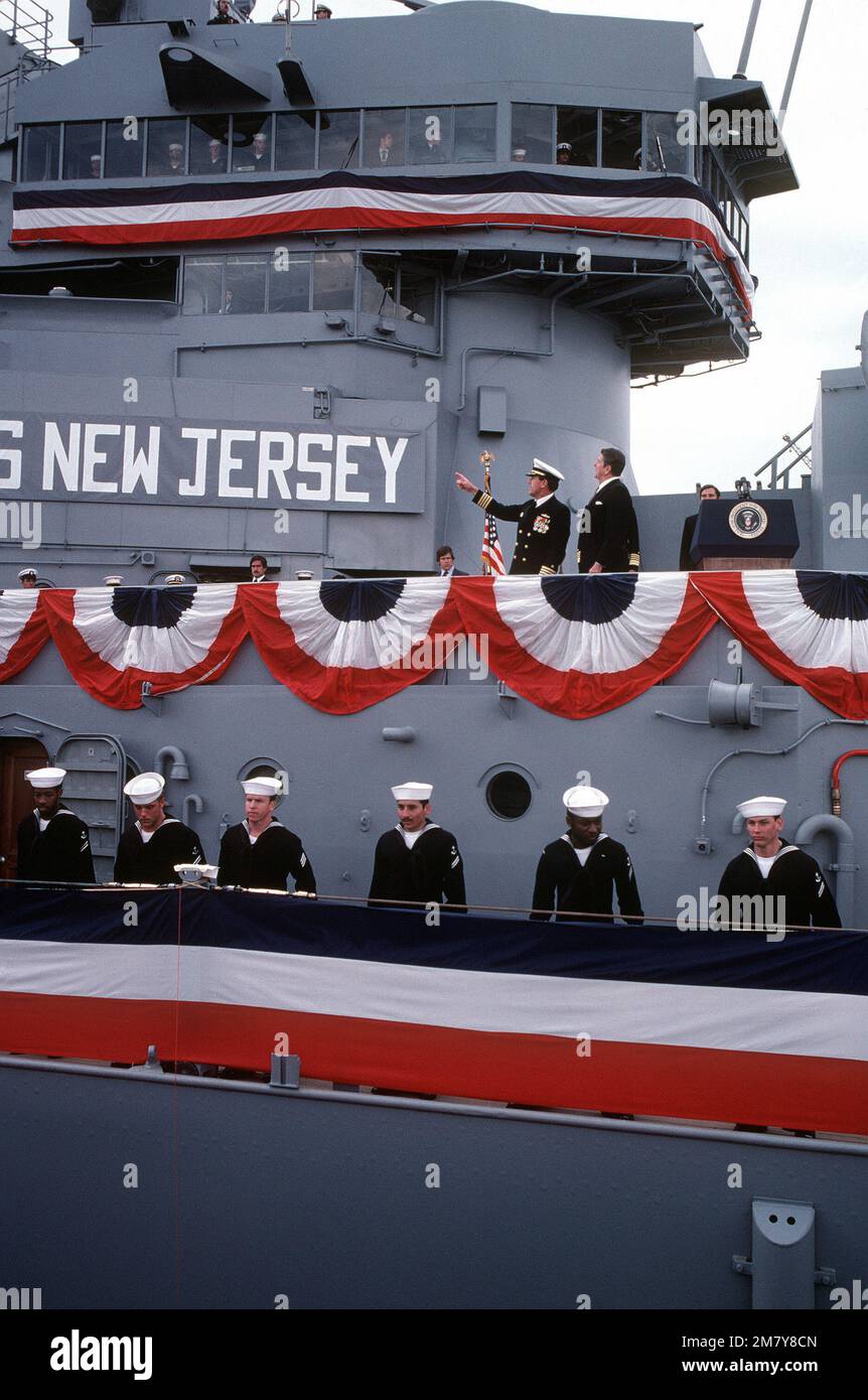 CAPT William M. Fogarty, commanding officer, points out something to ...