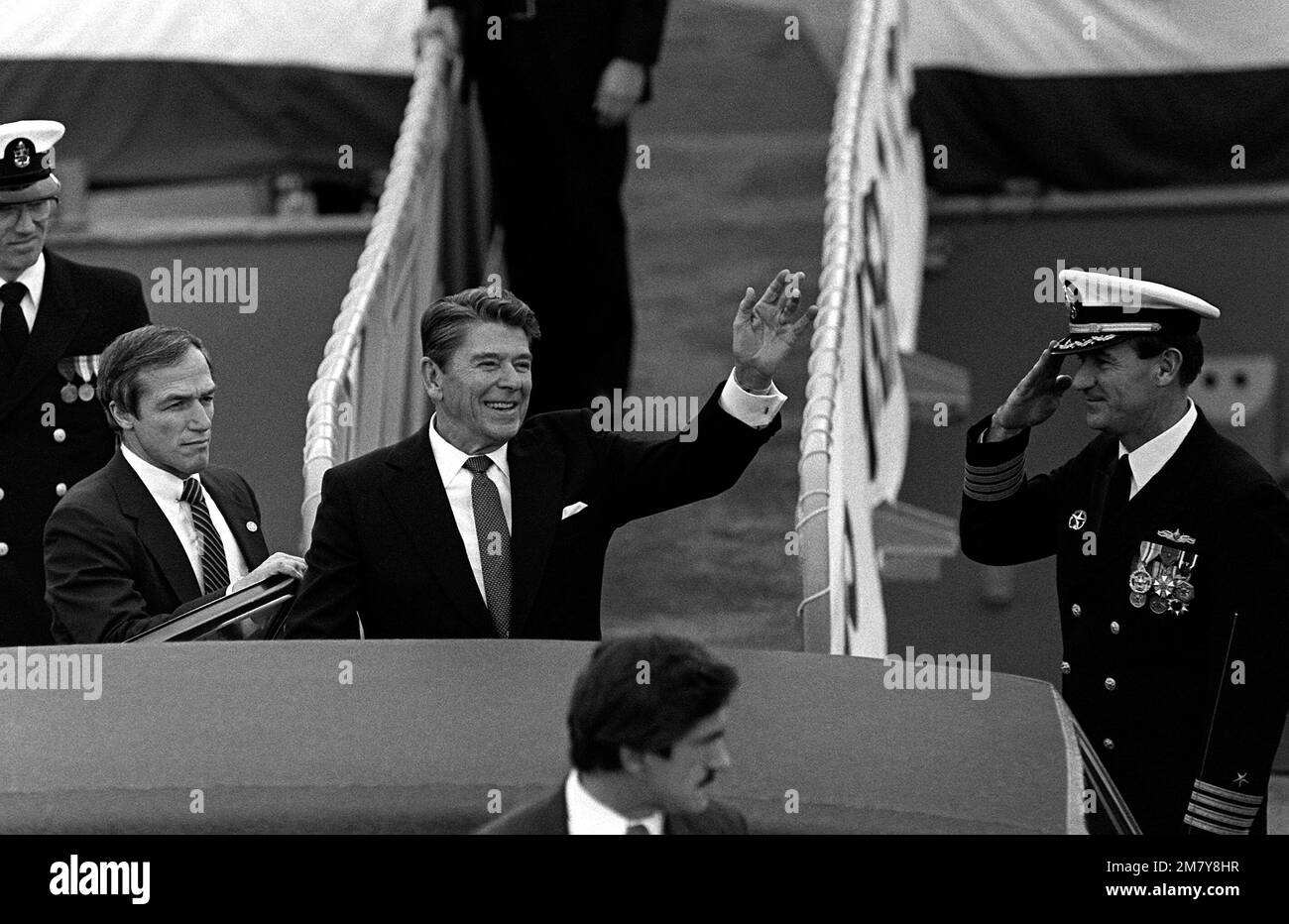 CAPT William M. Fogarty, commanding officer, salutes and President ...
