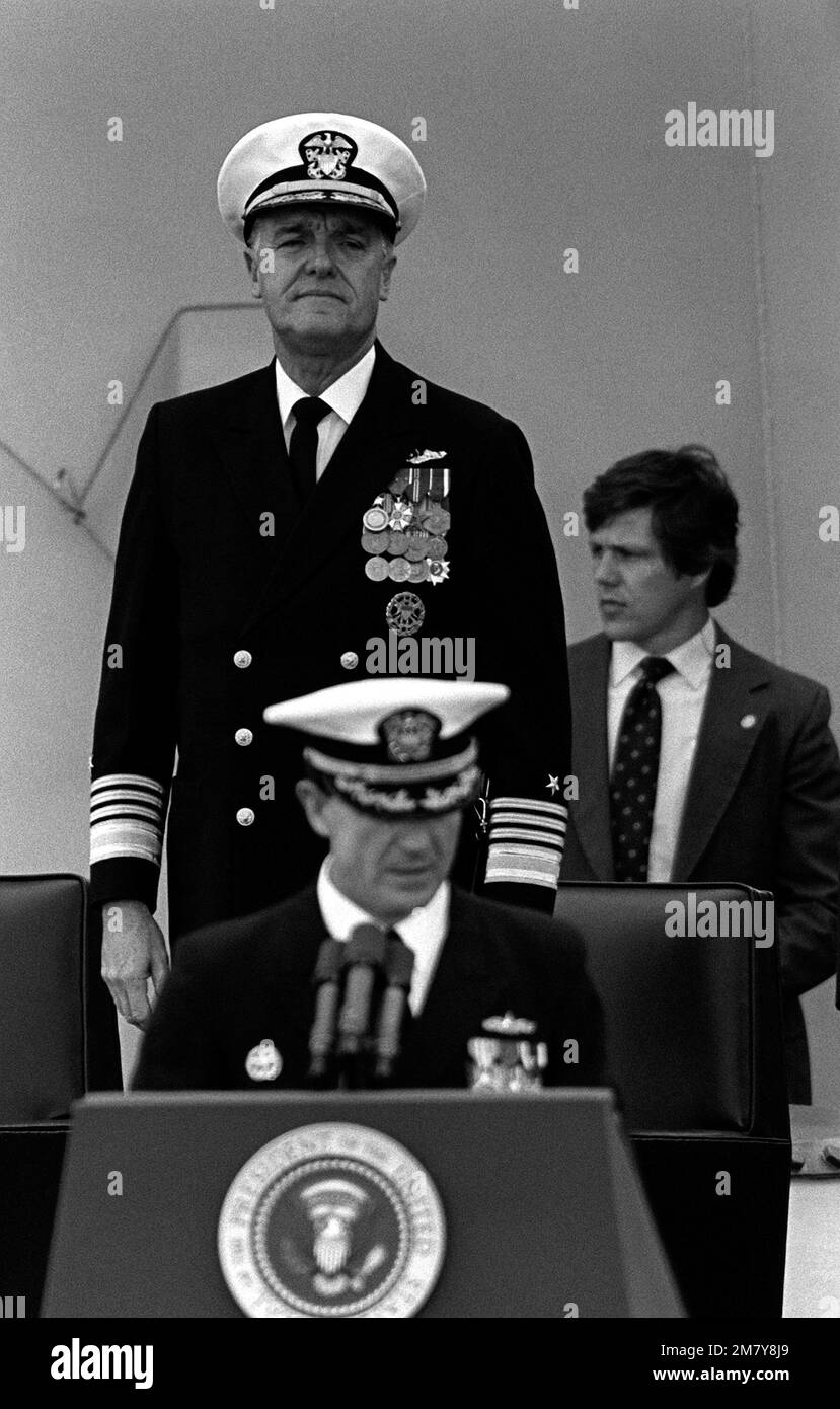 CHIEF of Naval Operations ADM James D. Watkins stands behind CAPT ...