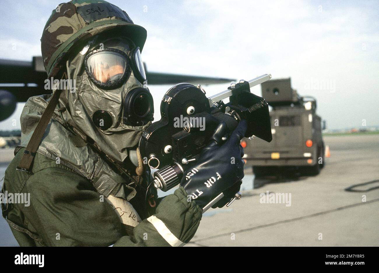 An Aerospace Audiovisual Service motion picture cameraman, wearing ...