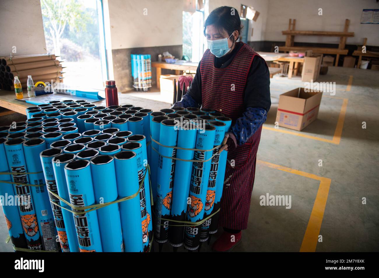 Changsha, China's Hunan Province. 11th Jan, 2023. An employee carries ...