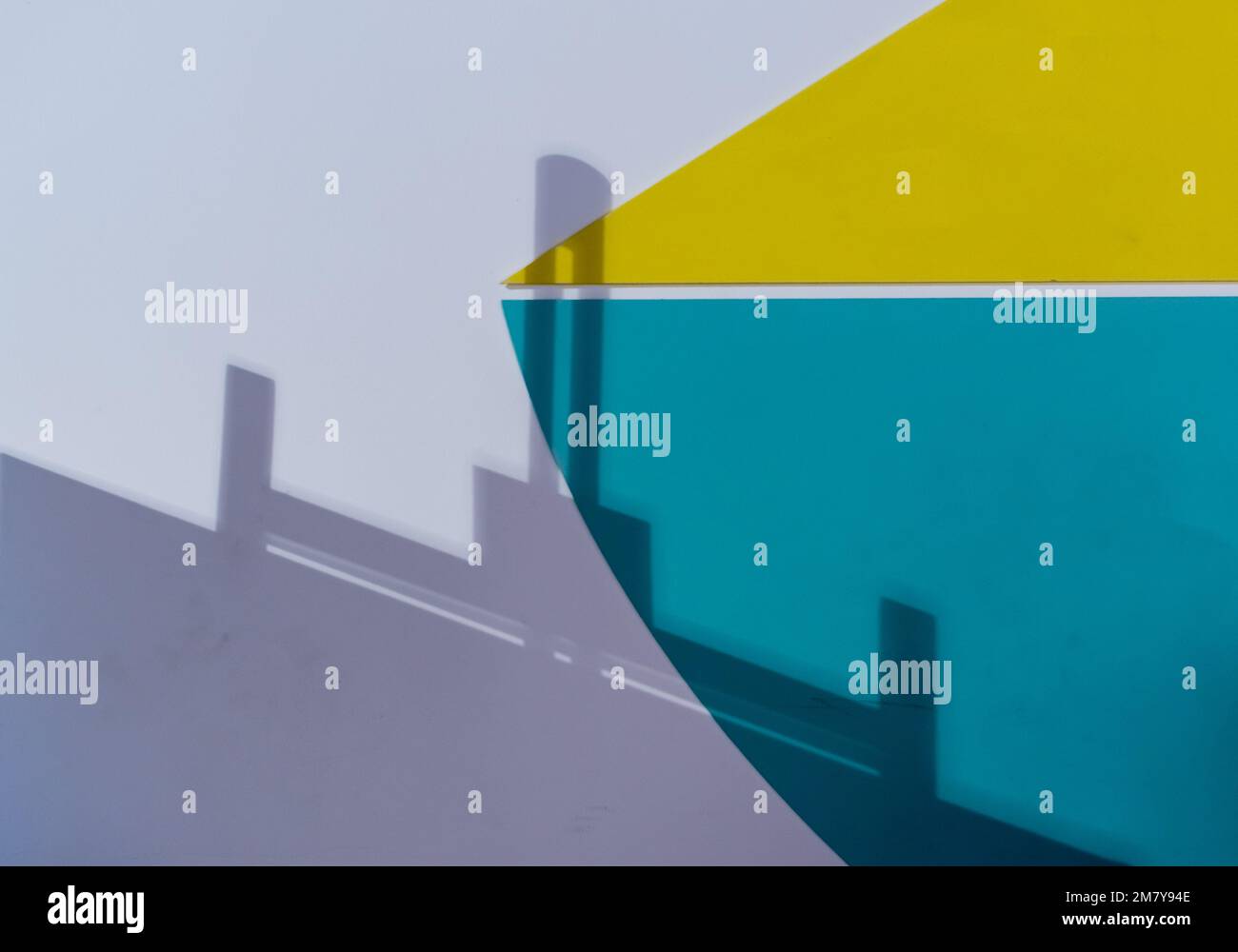 Blurred shadow of geometric figures on colorful wall Stock Photo - Alamy