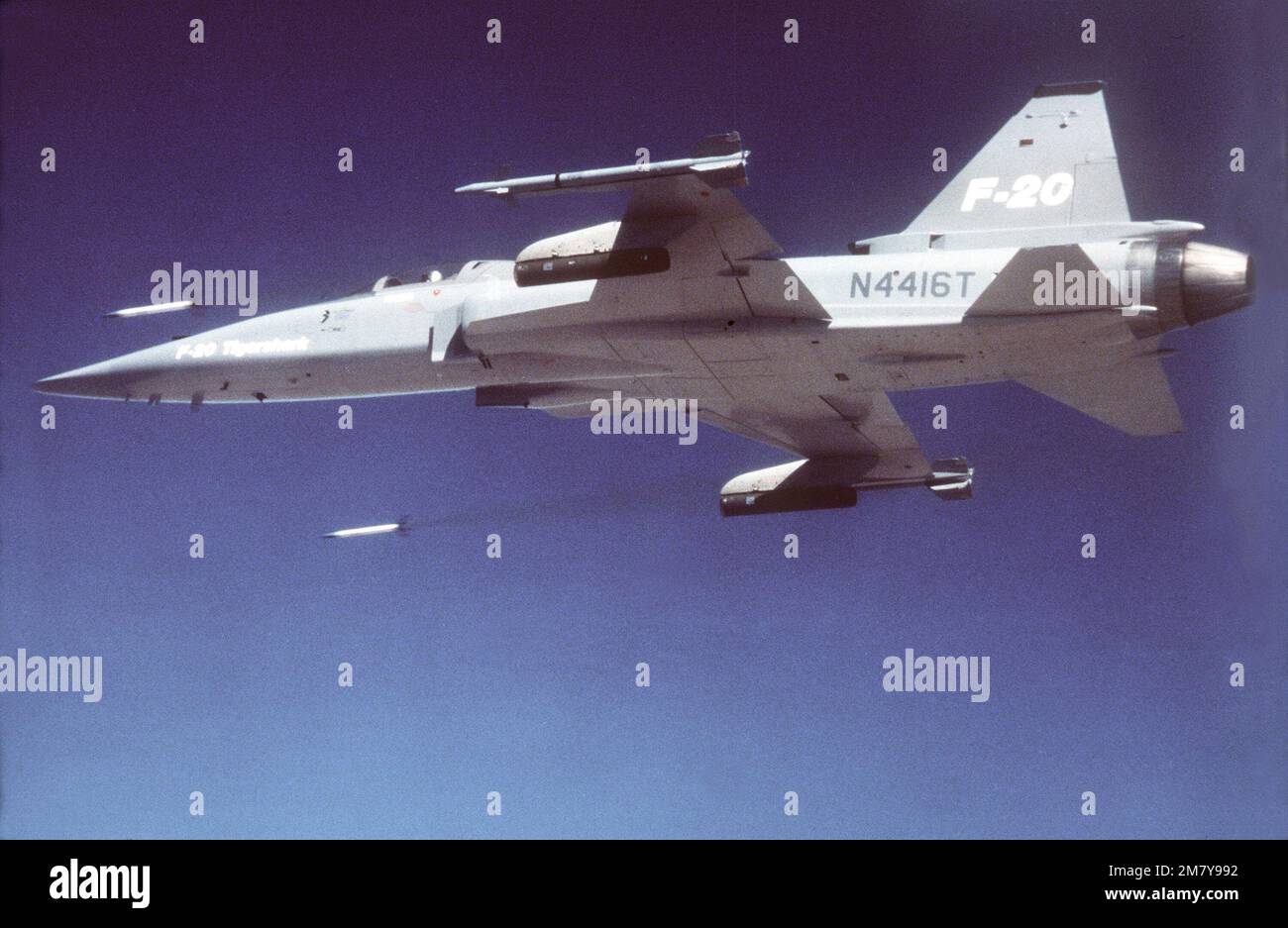 An air-to-air left side view of a Northrop F-20 Tigershark aircraft ...