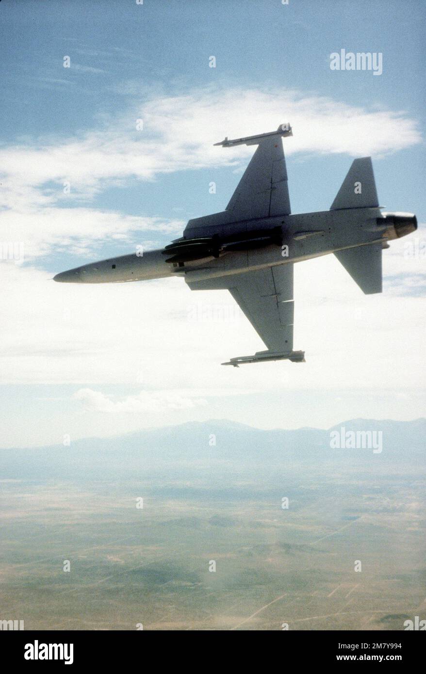 An air-to-air underside view of a Northrop F-20 Tigershark aircraft ...