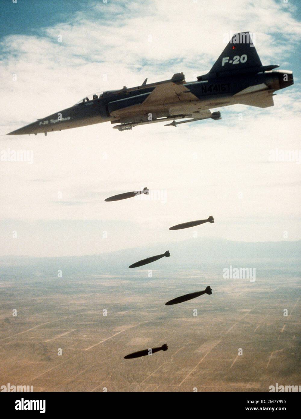 An air-to-air left side view of a Northrop F-20 Tigershark aircraft ...