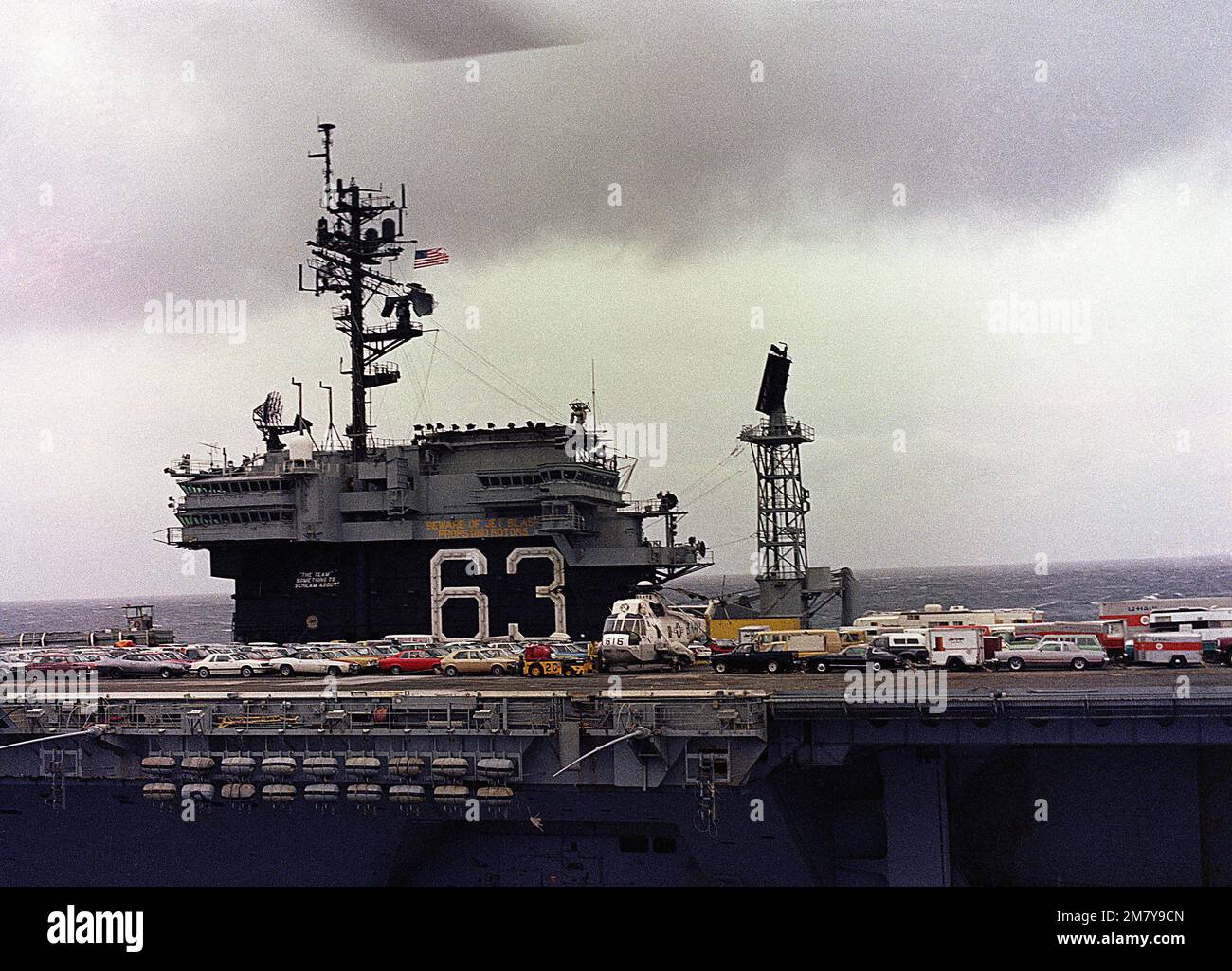 A port side view of the island structure aboard the aircraft carrier ...