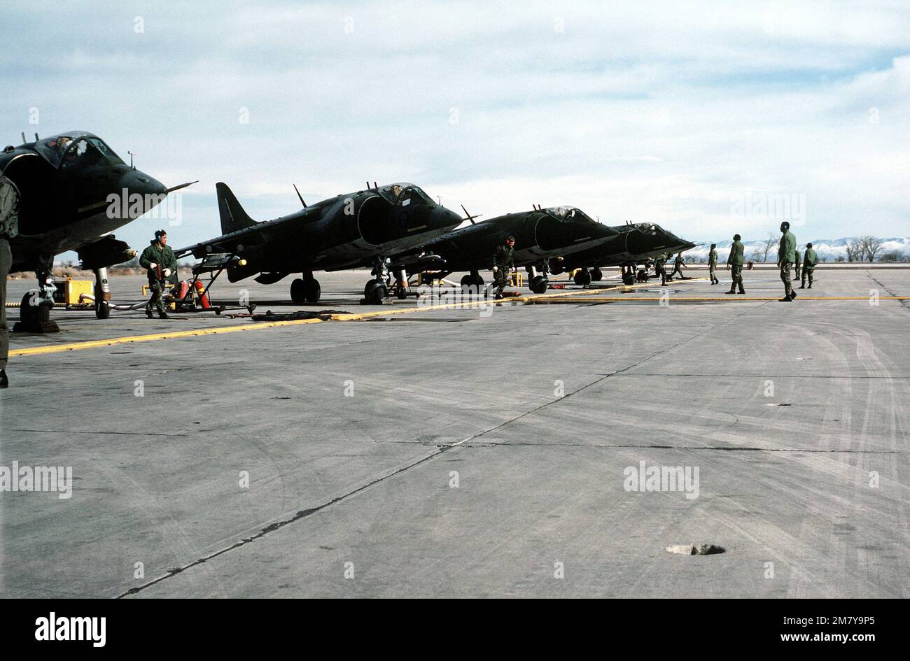 A view of AV-8B Harrier aircraft on the flight line, as they are ...
