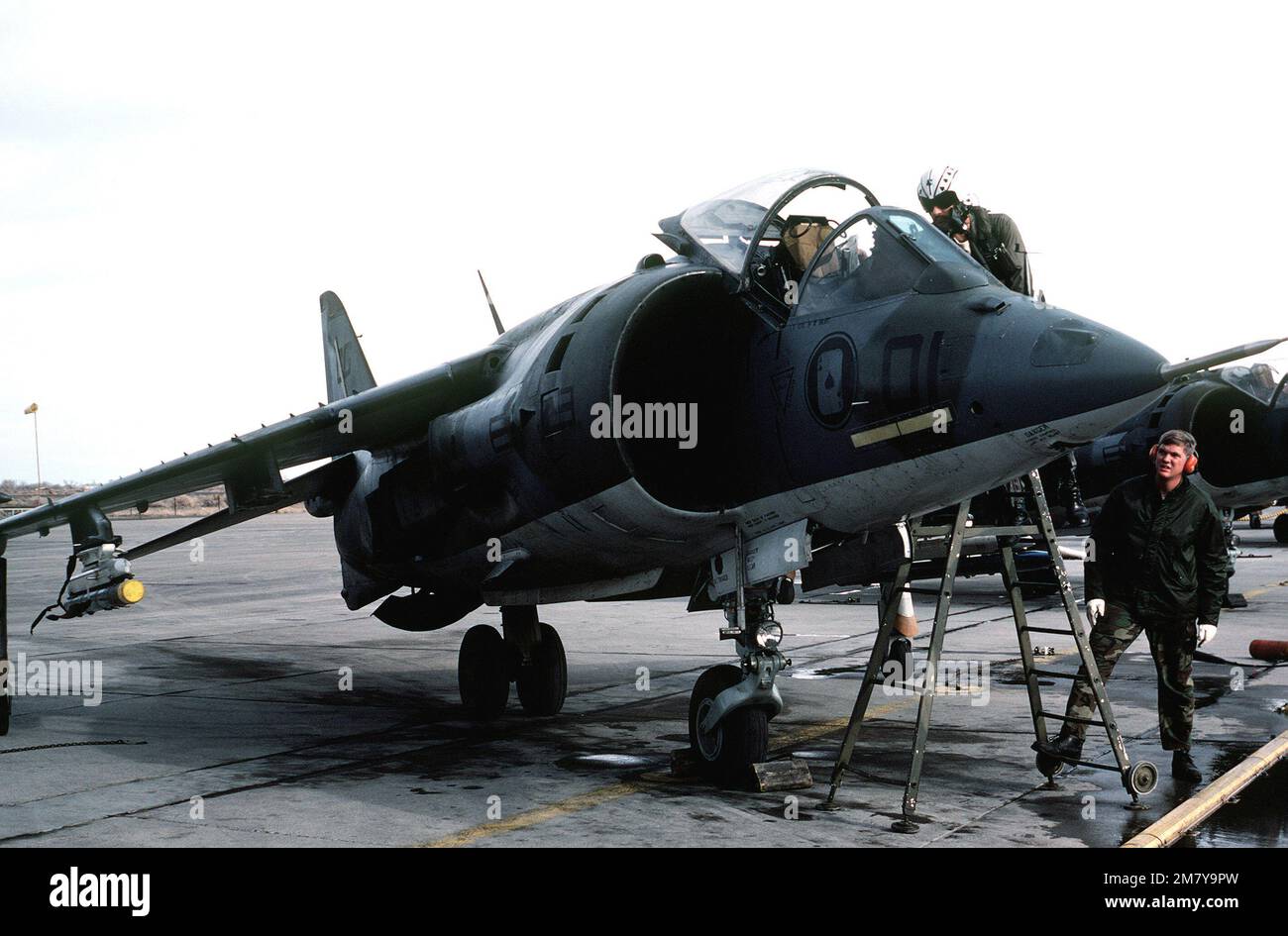 A view of an AV-8B Harrier aircraft as it is prepared for flight ...