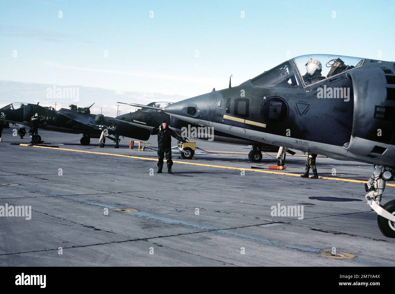 A view of an AV-8B Harrier aircraft with a camouflage paint scheme, as ...