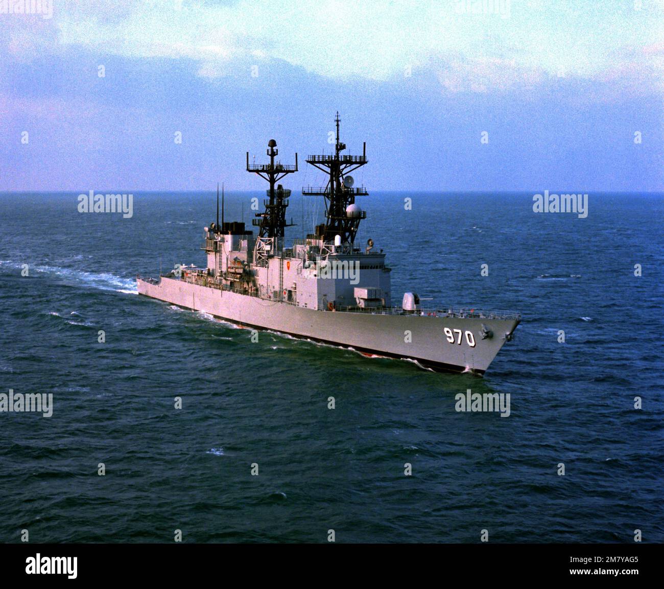An aerial starboard bow view of the Spruance class destroyer USS CARON ...