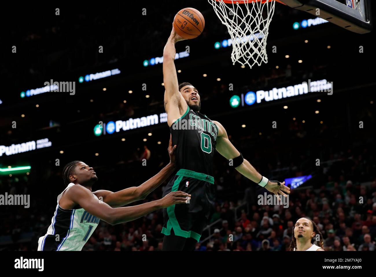 Boston Celtics' Jayson Tatum (0) shoots in front of Orlando Magic's Mo ...