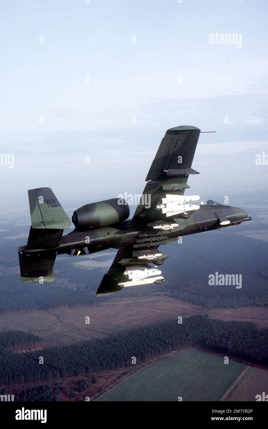 An air-to-air right underside view of an A-10 Thunderbolt II aircraft ...