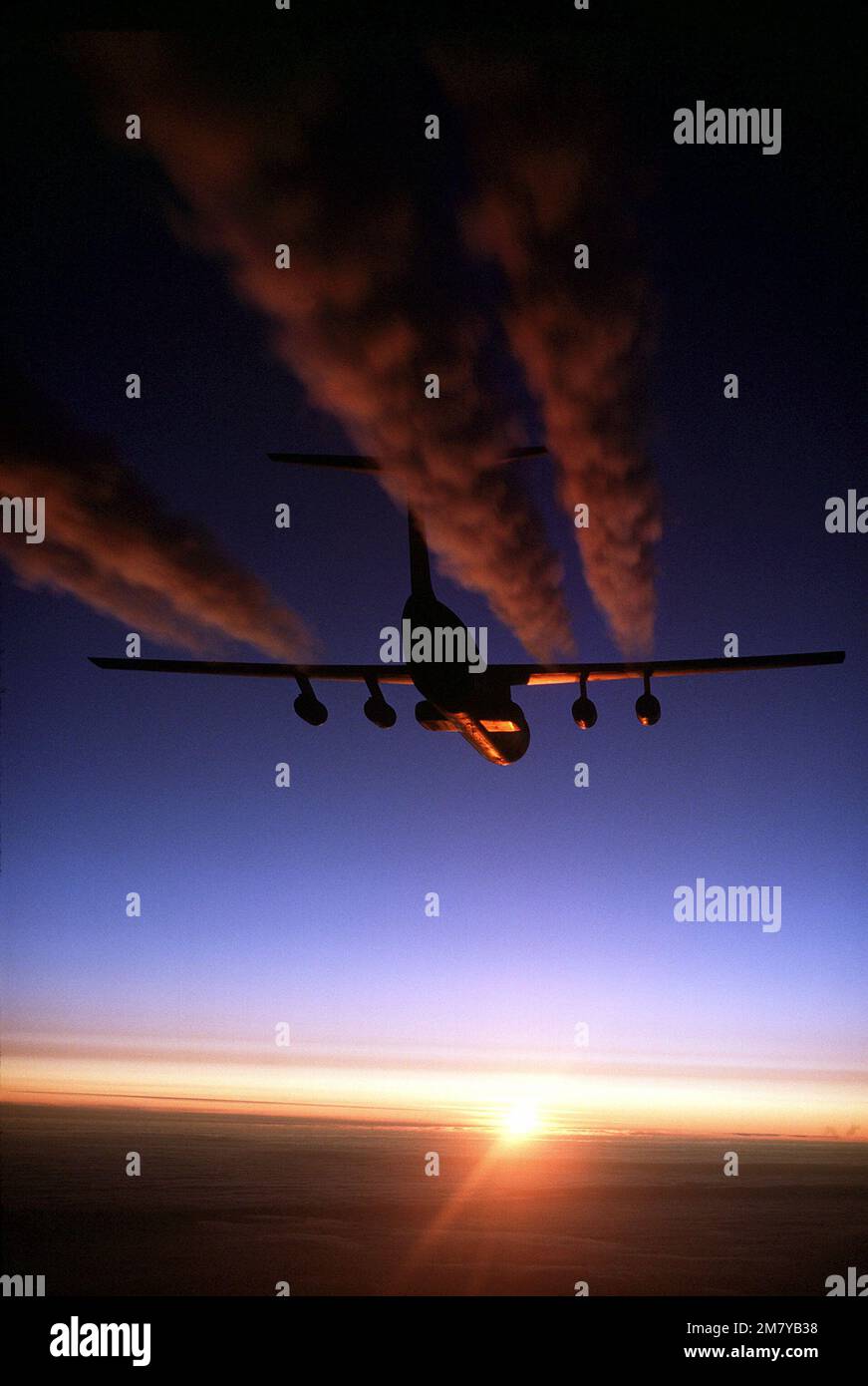 Ground-to-air rear view of a C-141B Starlifter aircraft preparing for ...