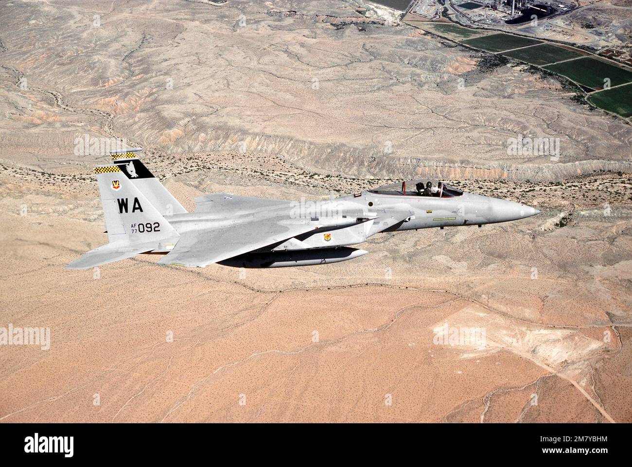An air-to-air right side view of an F-15 Eagle aircraft from the 57th ...