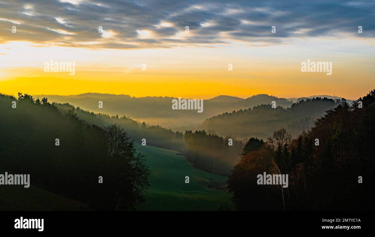 A beautiful view of a mountainous landscape during sunrise Stock Photo ...