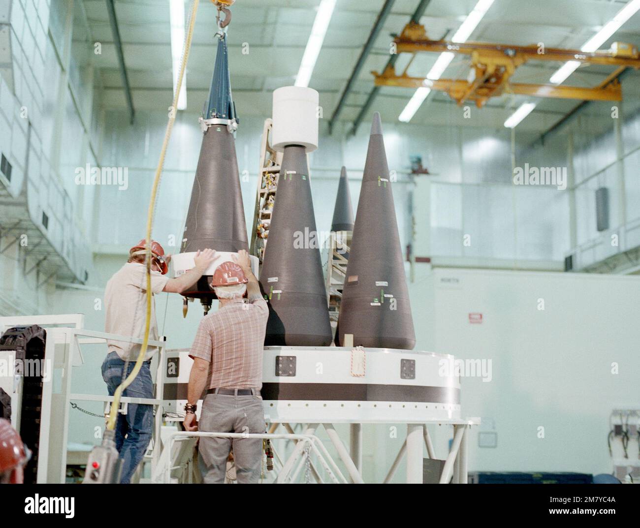 Technicians place cones on the top of the ring of an MX pathfinder ...