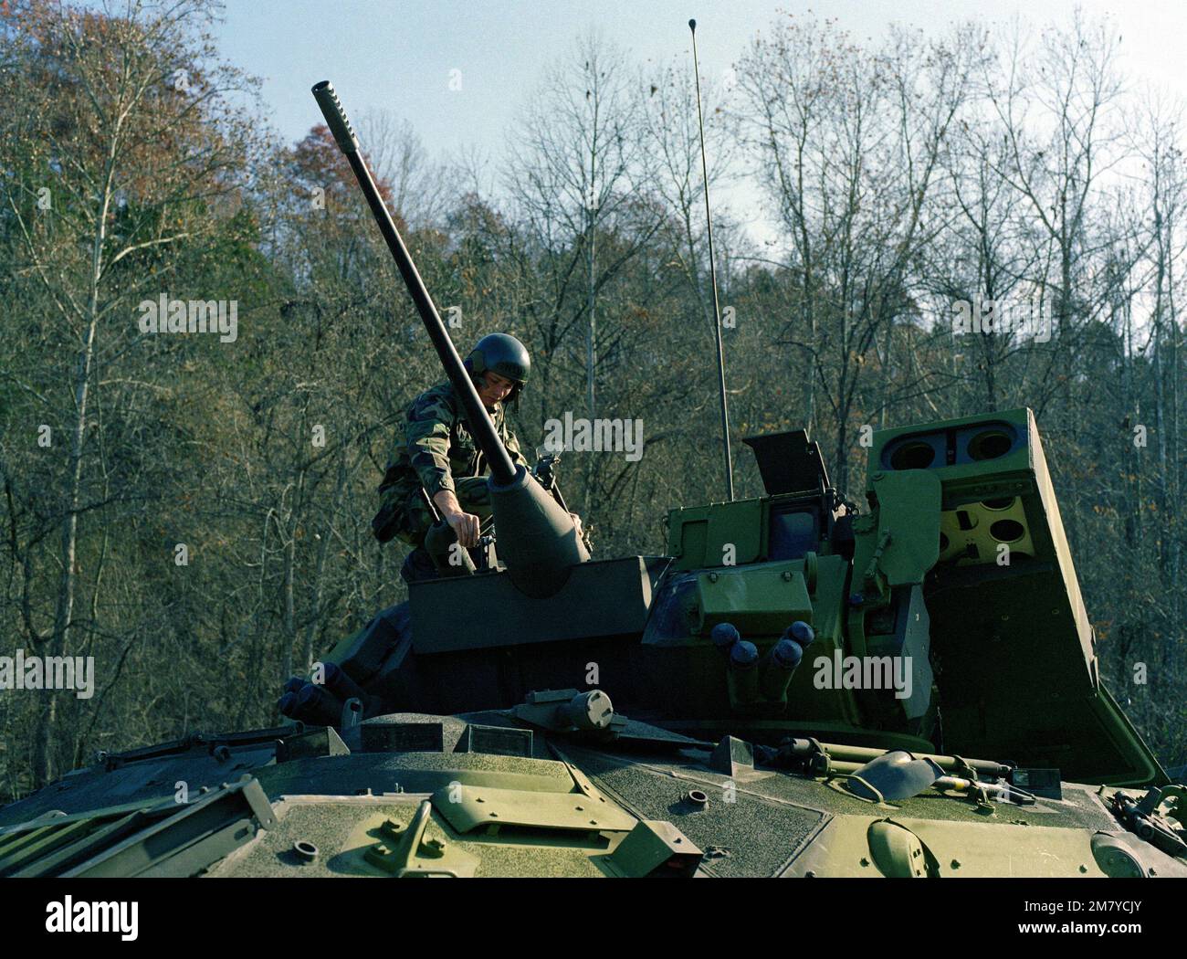 PFC Jackie L. Grider, 3rd Plt., E Trp., 2nd Bn., 6th Cav., works on the ...