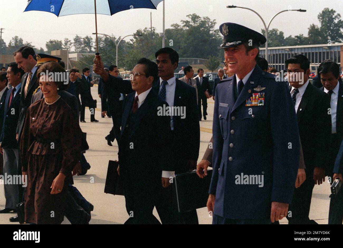 President Ferdinand E. Marcos of the Philippines, center, is escorted ...