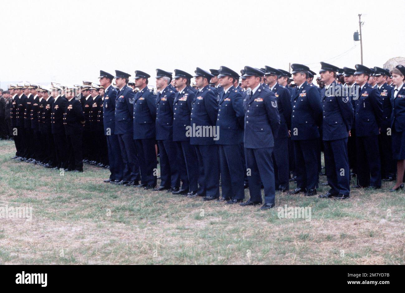 Military personnel stand in formation during the dedication ceremony ...