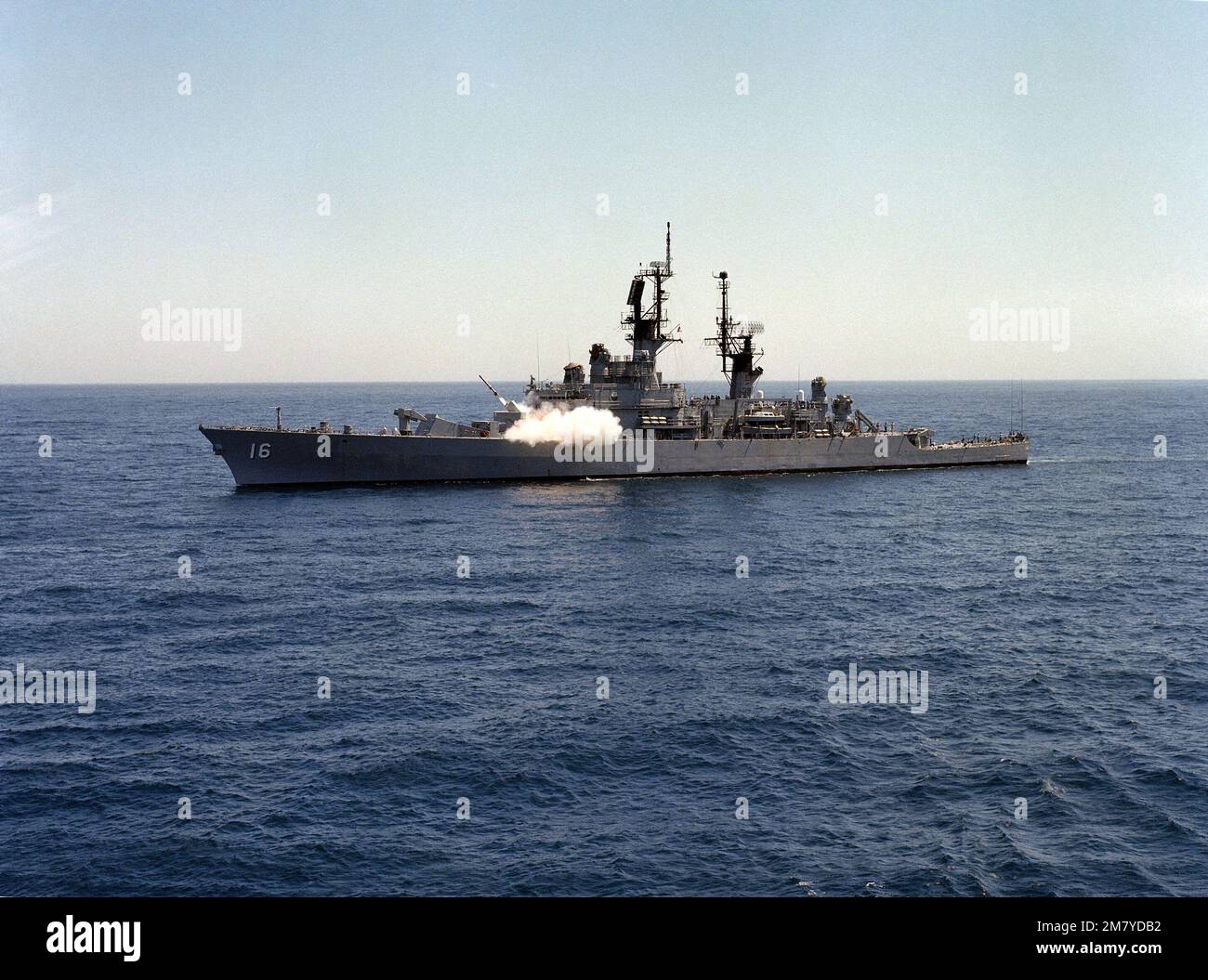 A port view of the guided missile cruiser USS LEAHY (CG 16) launching ...
