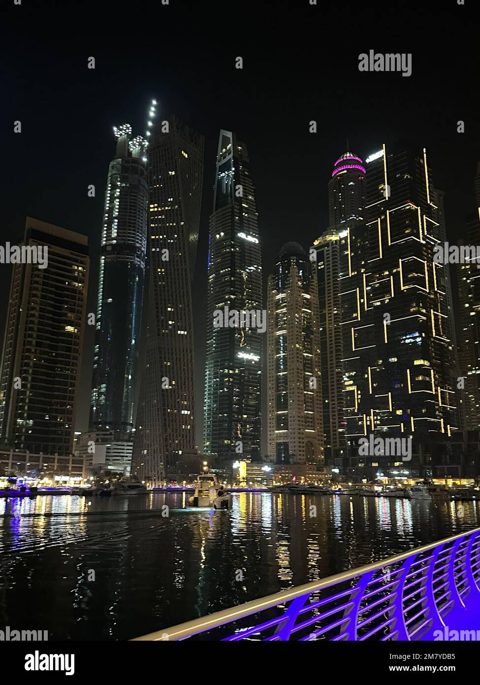 A vertical shot of Marina Gate illuminated with lights at night in ...