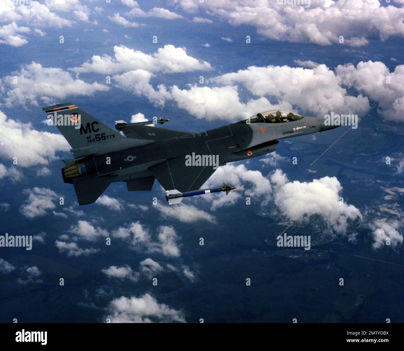 An air-to-air view of an F-16 Fightng Falcon aircraft over Hill Air ...