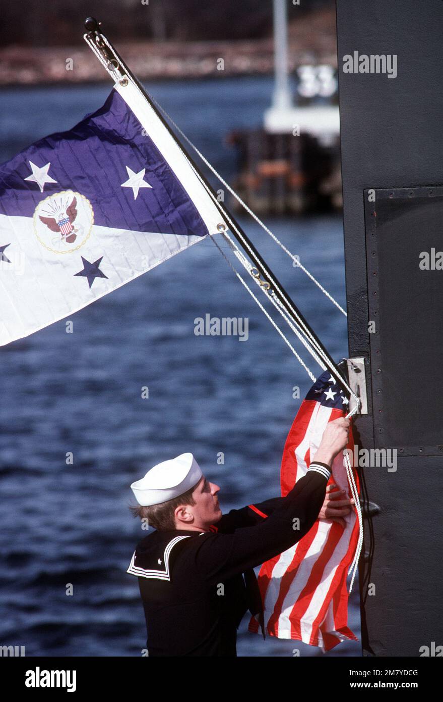 A crewman aboard the nuclear-powered attack submarine USS CITY OF ...