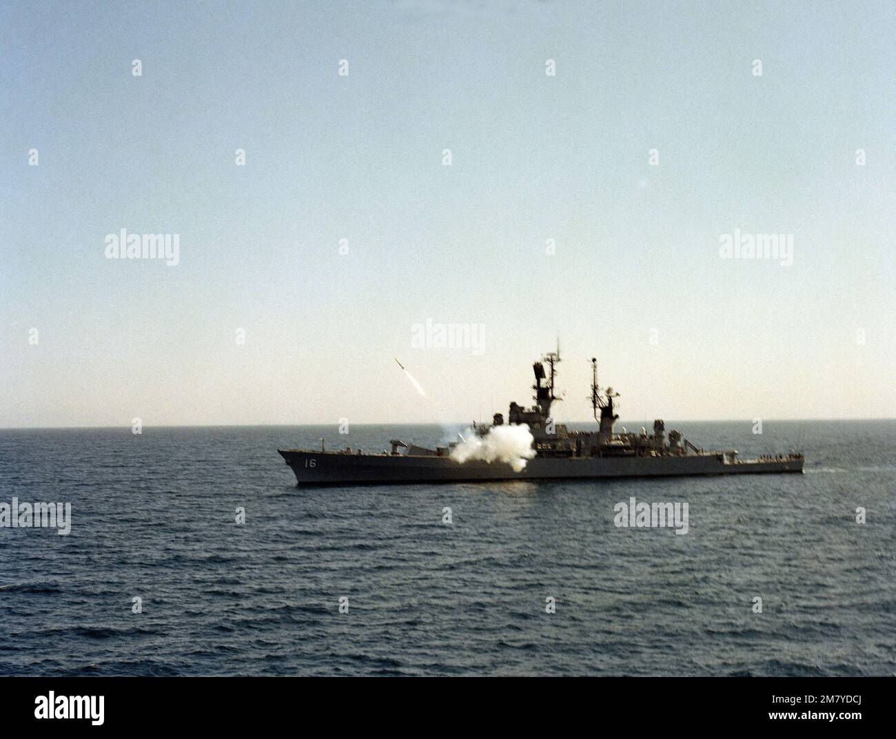 A port view of the guided missile cruiser USS LEAHY (CG 16) launching ...