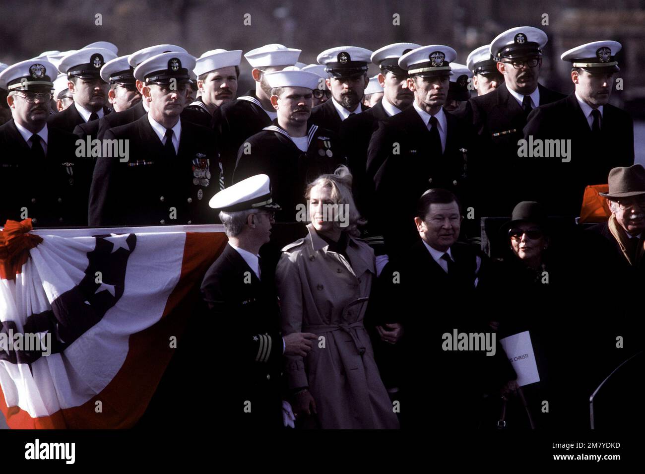 A view of distinguished guests and crewmen aboard the nuclear-powered ...