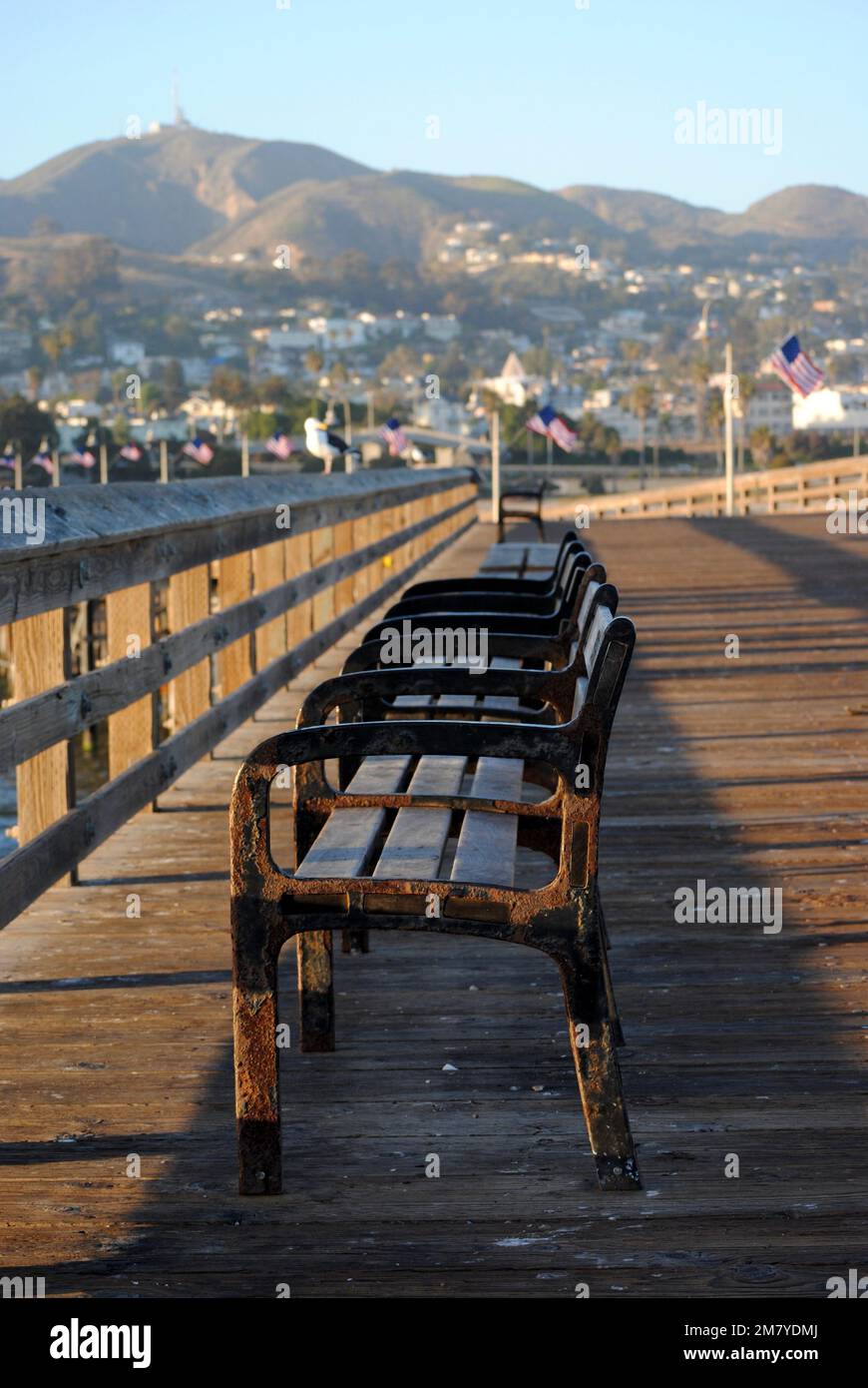 Side view of benches at sunset in Ventura Pier, California Stock Photo ...