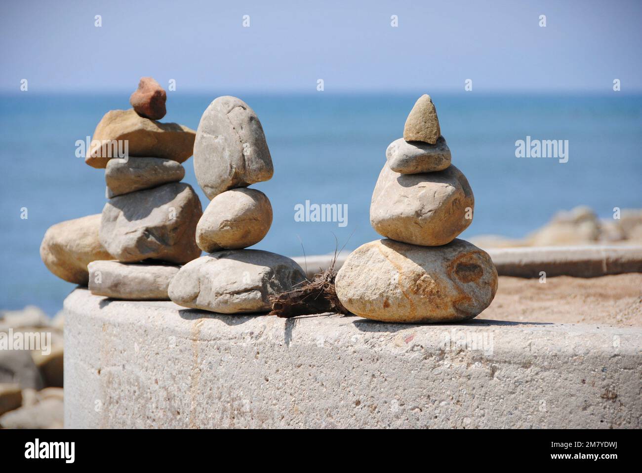 Stone cairn towers. Piles of pebble stones Stock Photo - Alamy