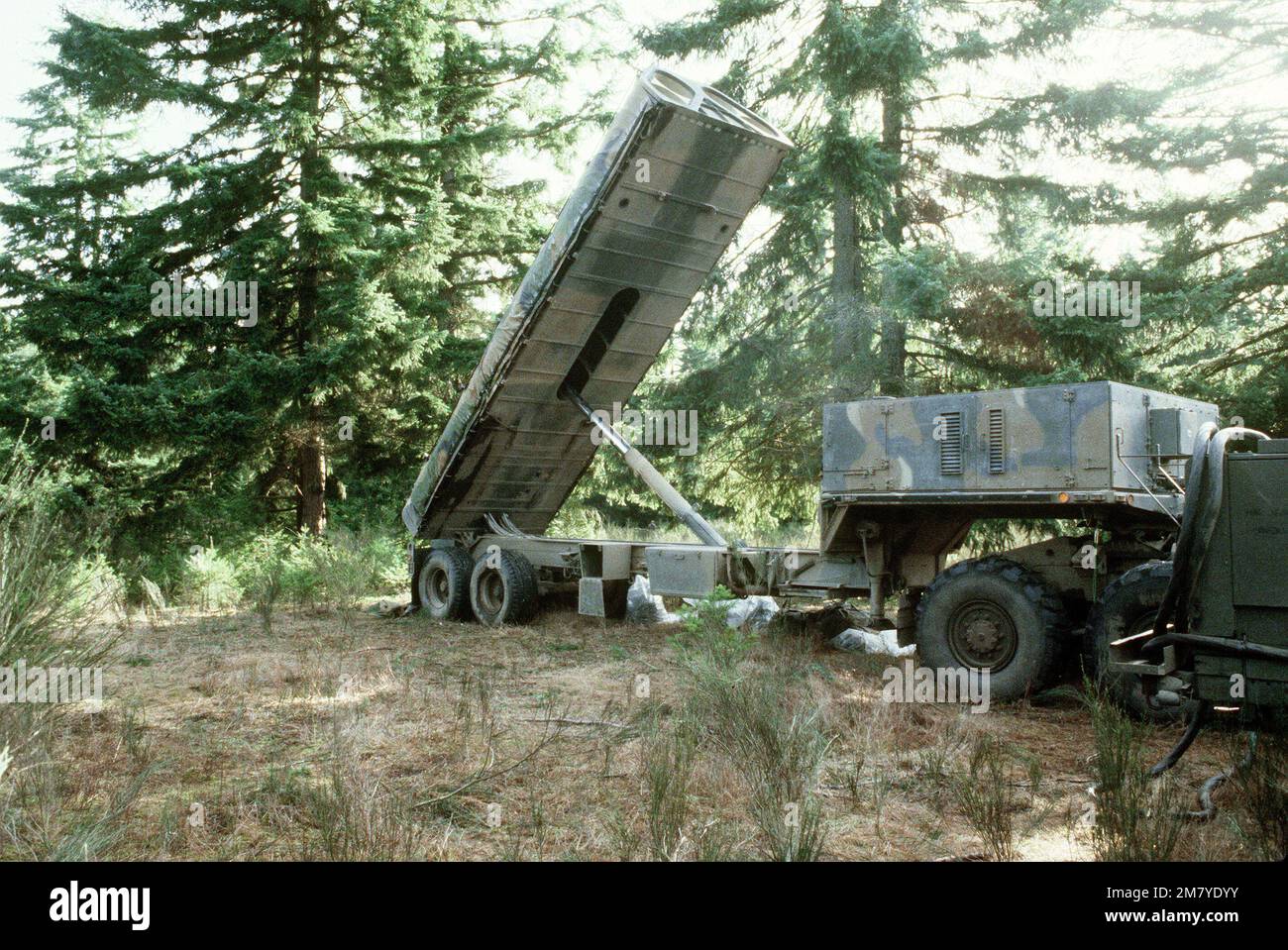 The launcher on a Transport-Erector-Launcher (TEL) vehicle is raised ...